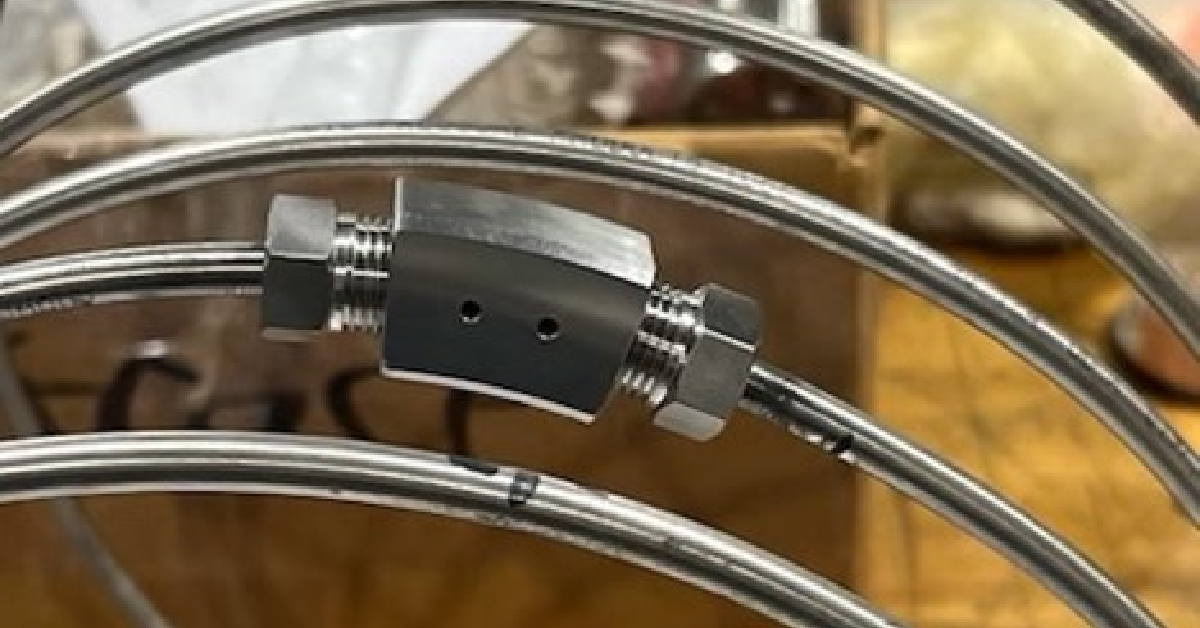 This curved coupling instantly fixes waterjet coil punctures and ...